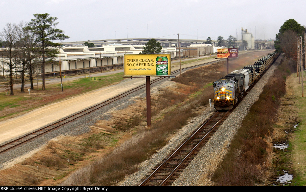 KCS 3901 leads southbound pipe train past Beaird Ind. Park